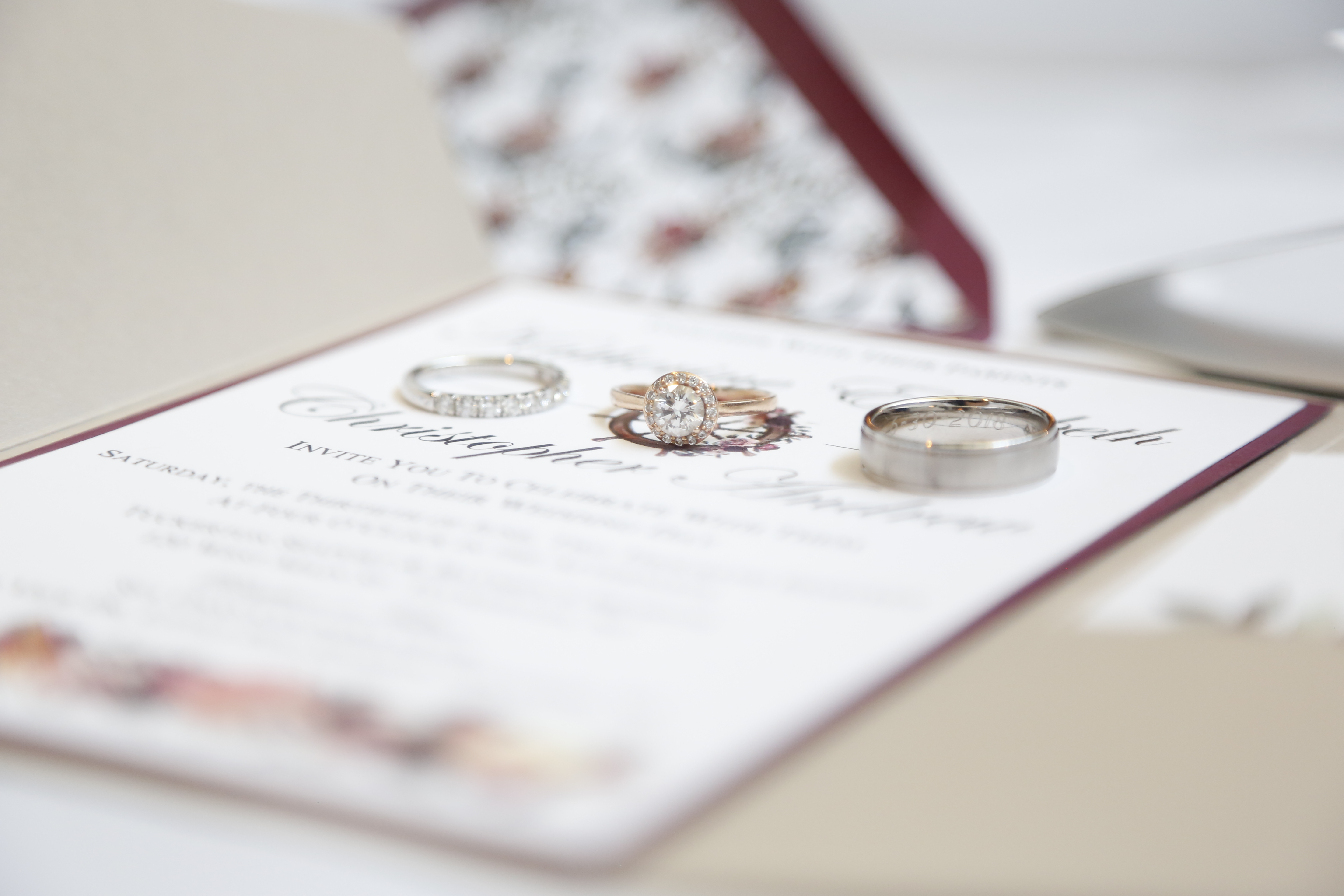 wedding invitation and wedding rings